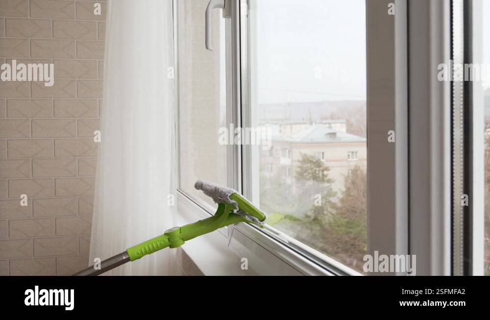 window cleaning of special mop for washing the glass surface of windows ...