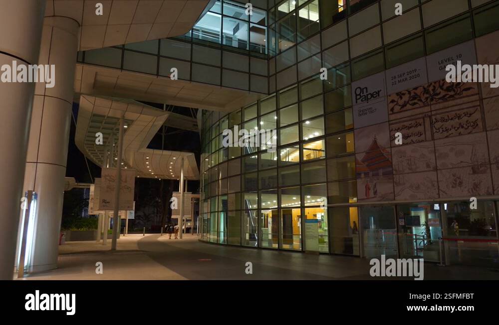 night time singapore city downtown library building front entrance ...