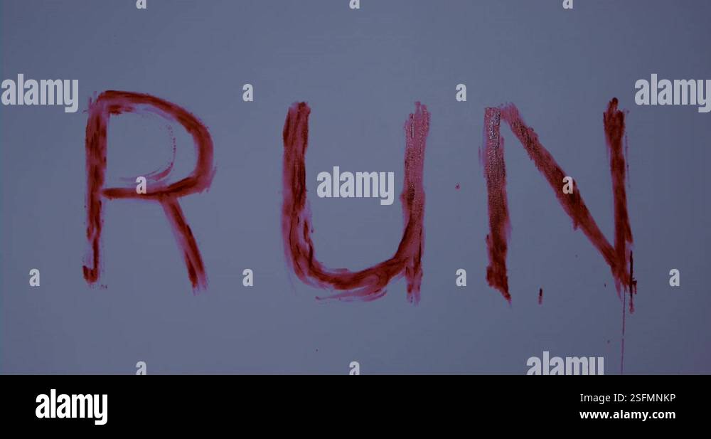 Creepy inscription RUN on the wall, written in blood or red paint ...