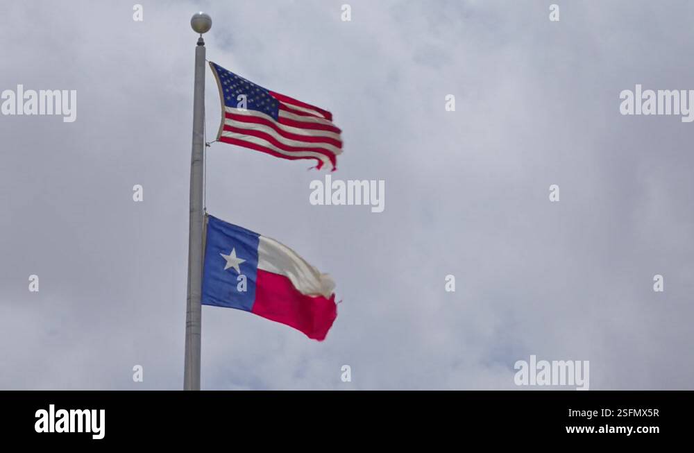 American and Texas Flags flying together waving in the wind Stock Video ...