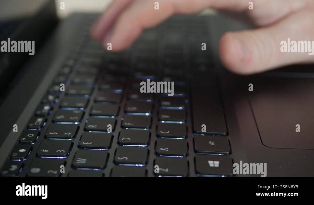 Blurred Shooting with a Businessman Typing a Text on Laptop Keyboard ...