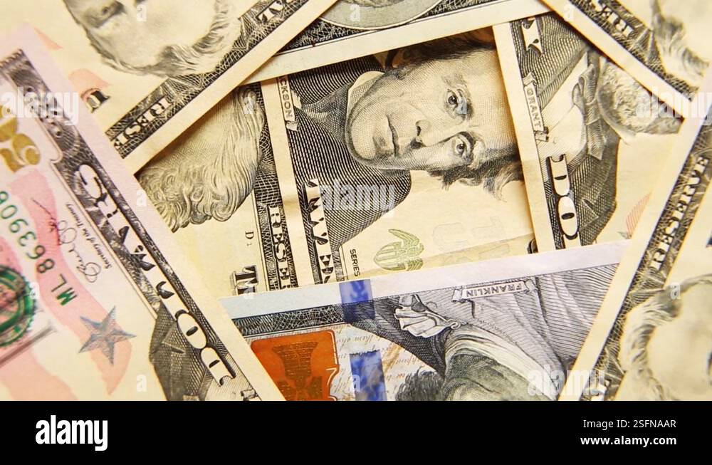 A bunch of US dollar banknotes of money are spinning in close-up Stock ...
