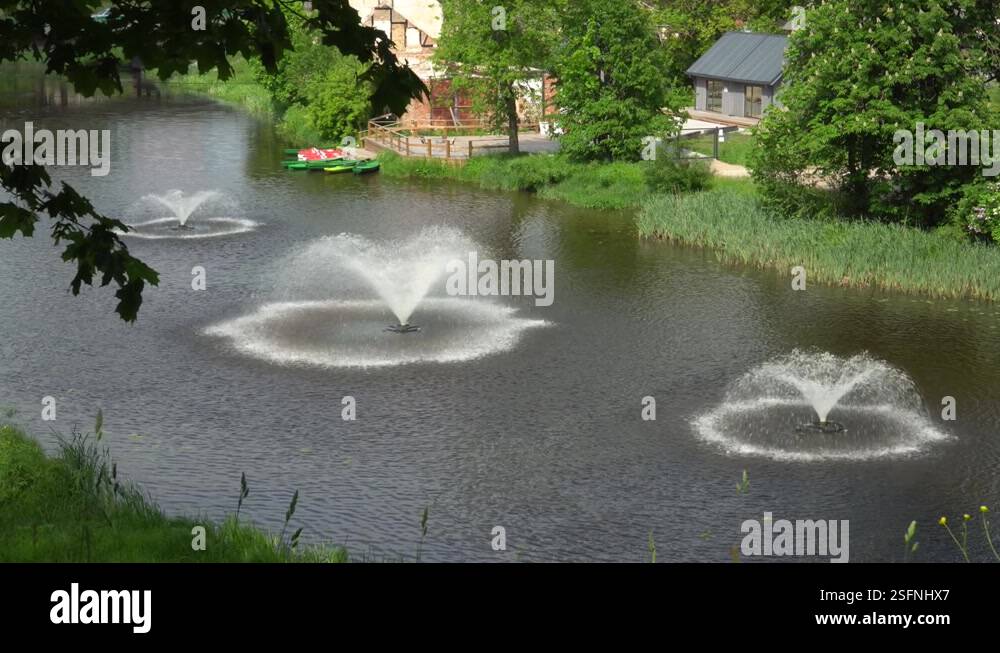 Landscape design with fountains on the river Stock Video Footage - Alamy