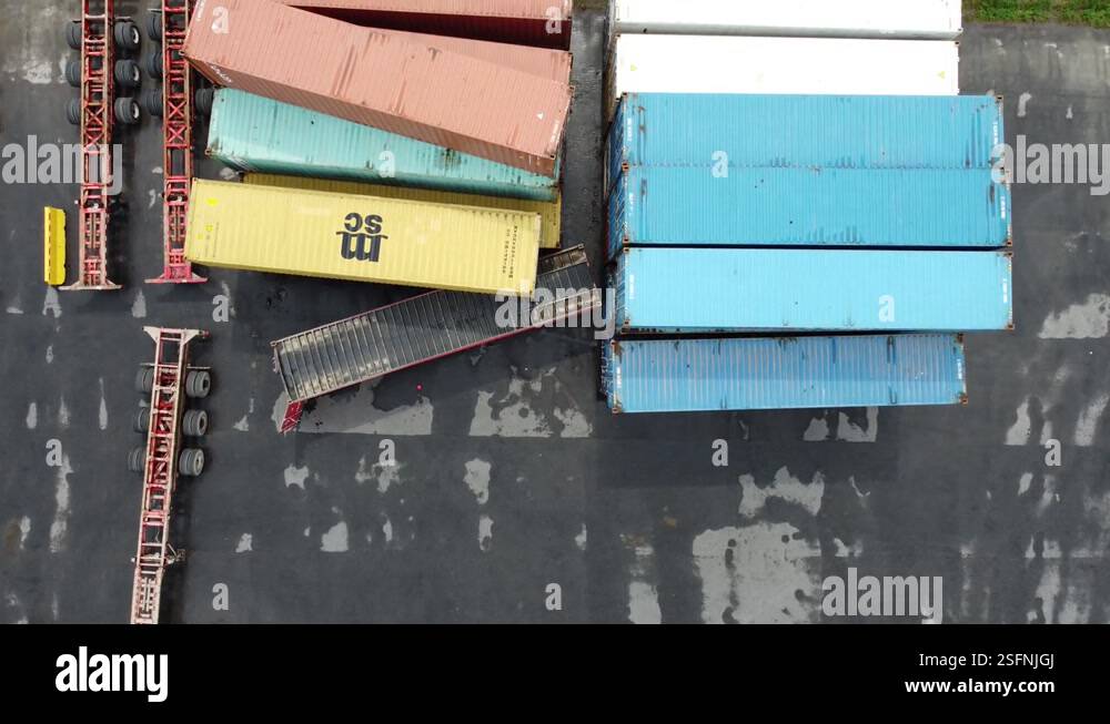 Pile of Shipping Containers blown by windstorm in Yard of Warehouse ...