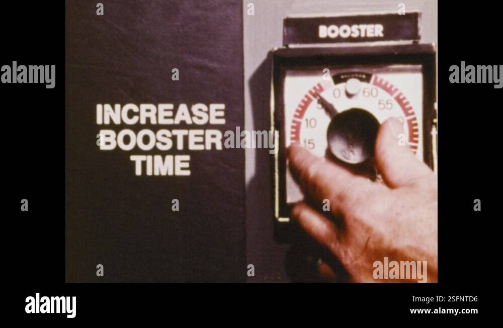 1970s: Factory. Man turns knob and dials on machine. Captions. Man ...