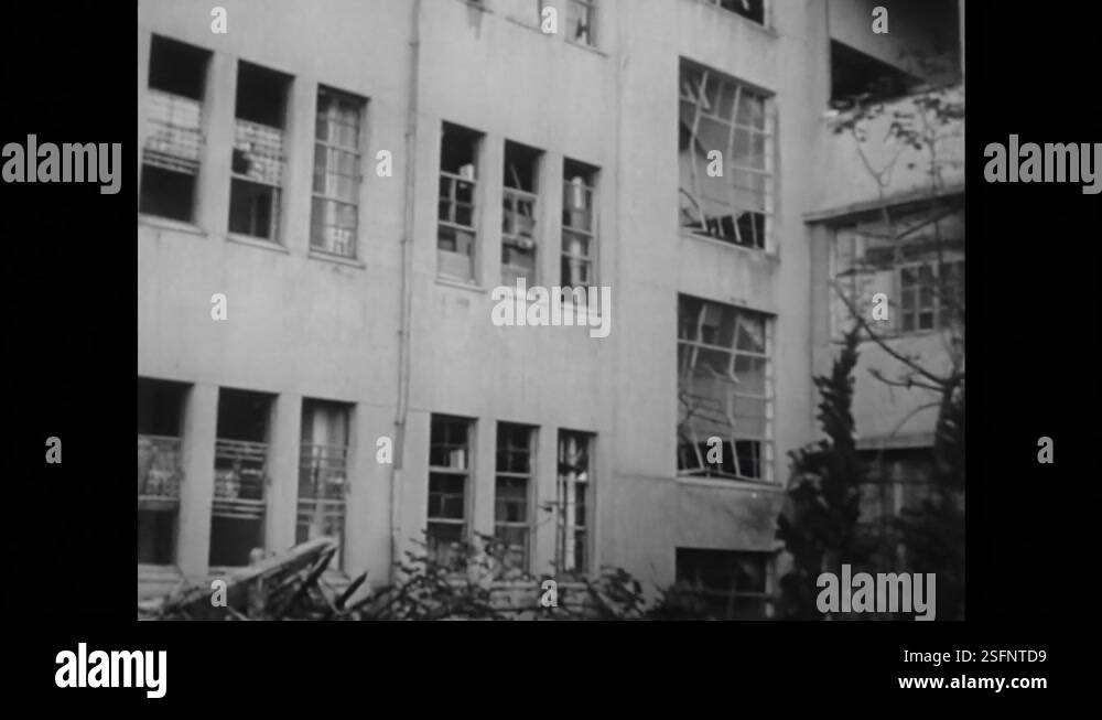 Japan 1940s: Window frames bent inwards on a hospital. Window frames ...