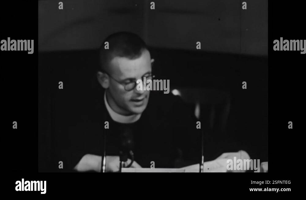 Japan 1940s: Jesuit priest sits behind a desk and reads a statement ...