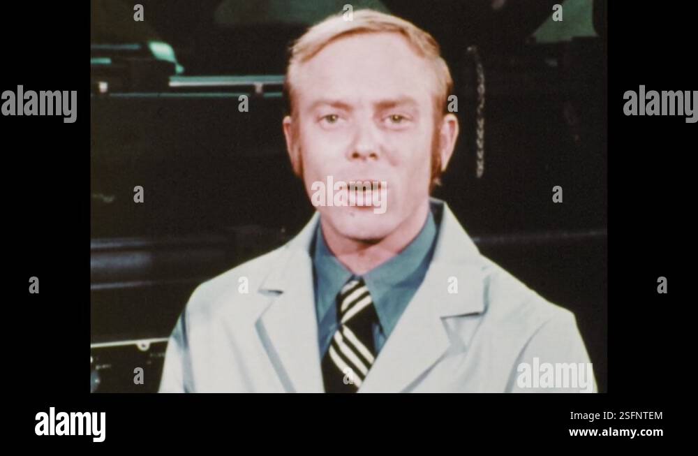 1970s: Factory. Man speaks. Caption says "PLEASE TURN OFF PROJECTOR NOW ...