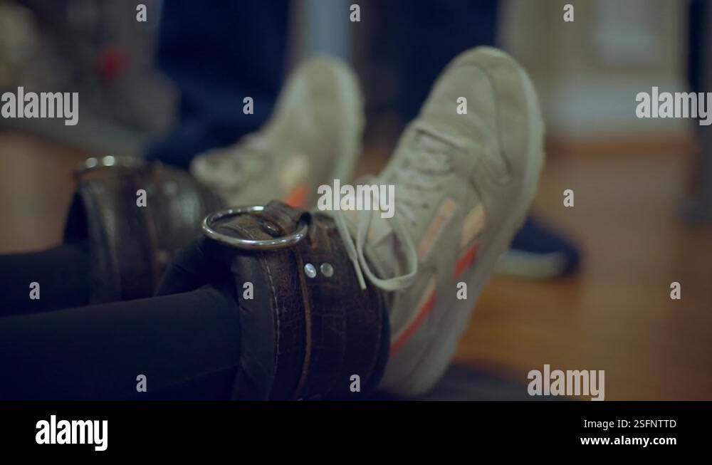 Stretching the legs in a crossover at kinesitherapy with a ...