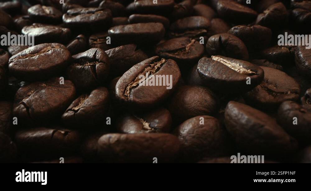 Fragrant coffee beans are roasted smoke comes from coffee beans. Shot ...