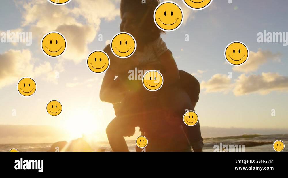 Animation of emoji icons over happy african american couple embracing ...