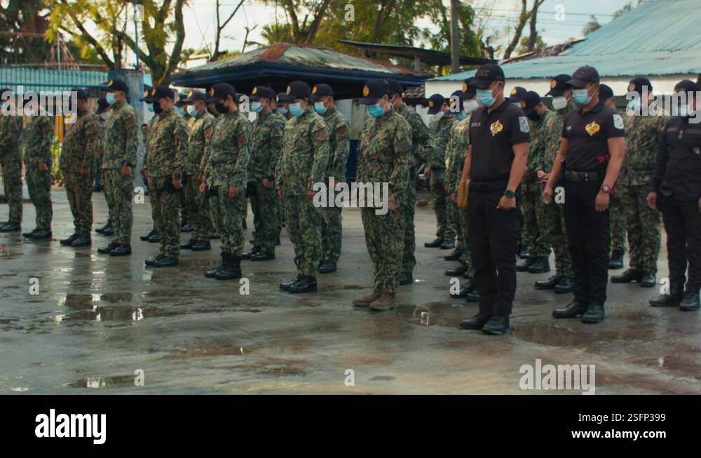 Philippine National Police officers attend a flag ceremony amidst a ...