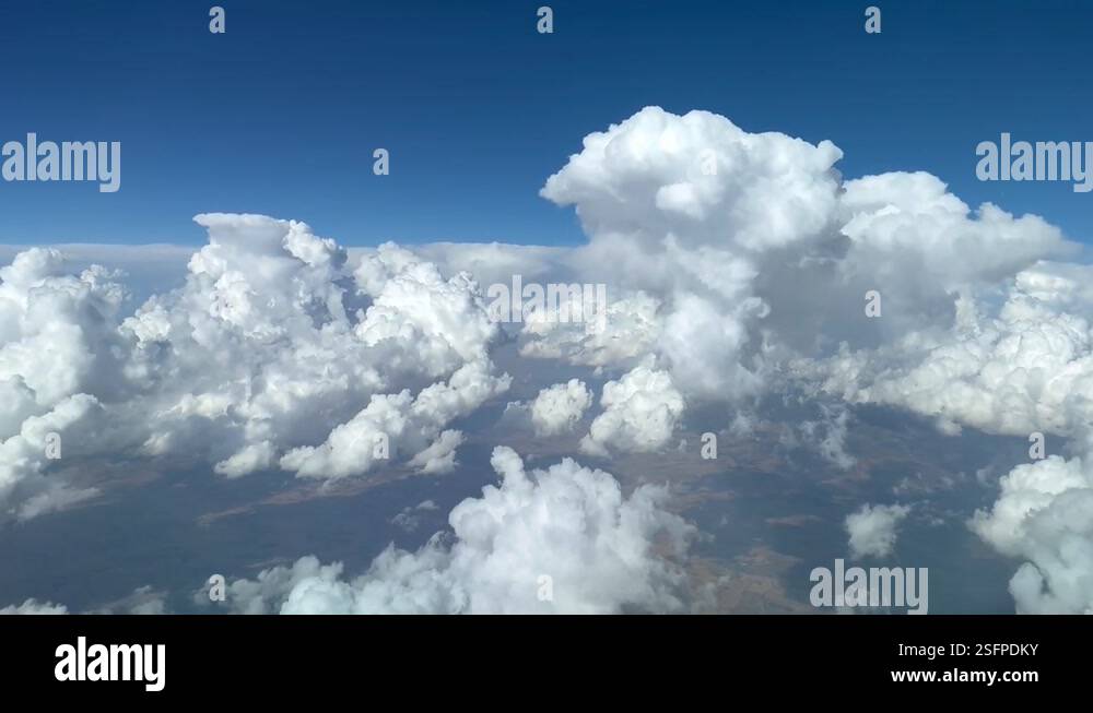 Unique aerial view. Pilot pov from a jet cockpit flying though a ...