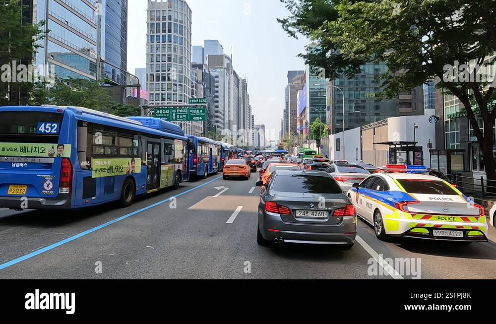 City Buses, Private Cars, And Police Car Stuck In The Traffic In The ...