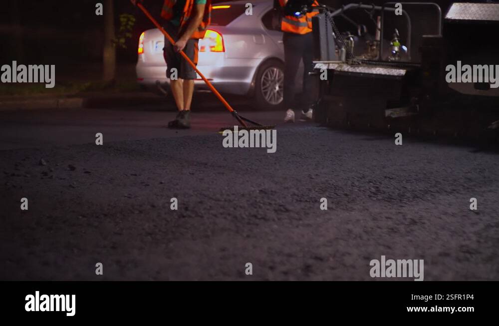 Roadworks. Asphalt leveling. Asphalt roller. Night scene Stock Video ...