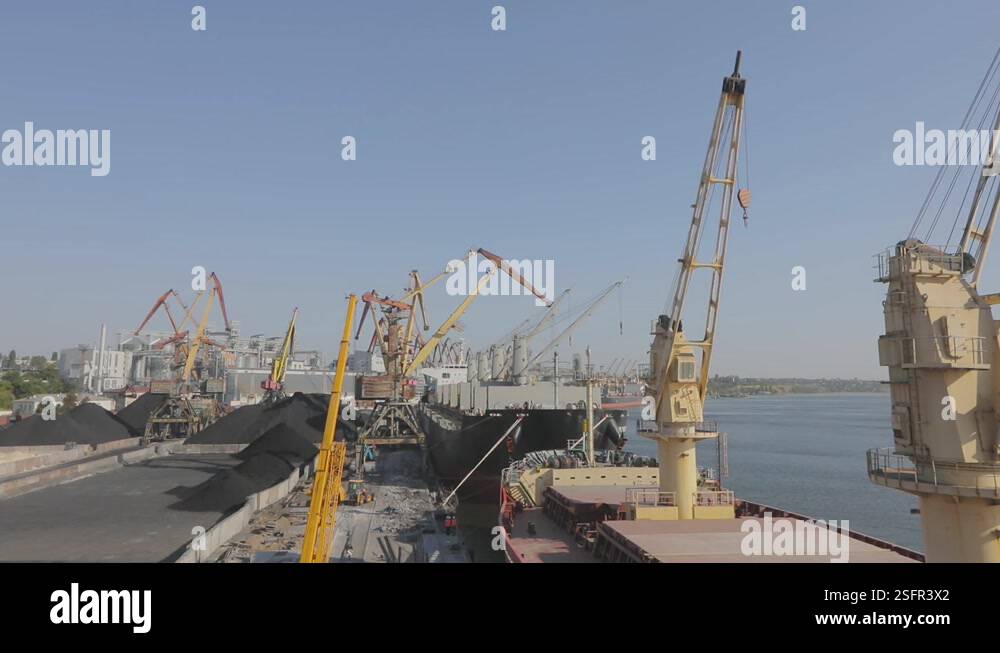 Loading bulk materials into the ship, loading the cargo ship with ...