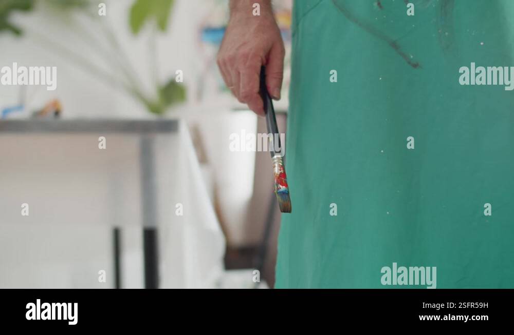 Closeup of man hand holding brush and then raising or lowering arm ...