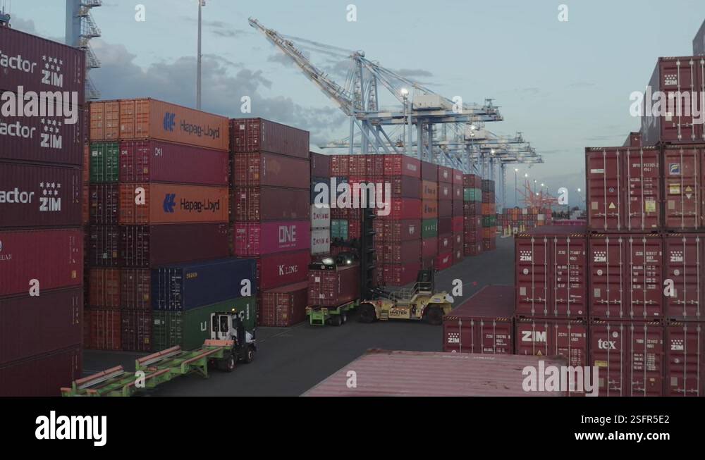 Machines Lifting Layers Of Massive Metal Storage Containers In The Port ...