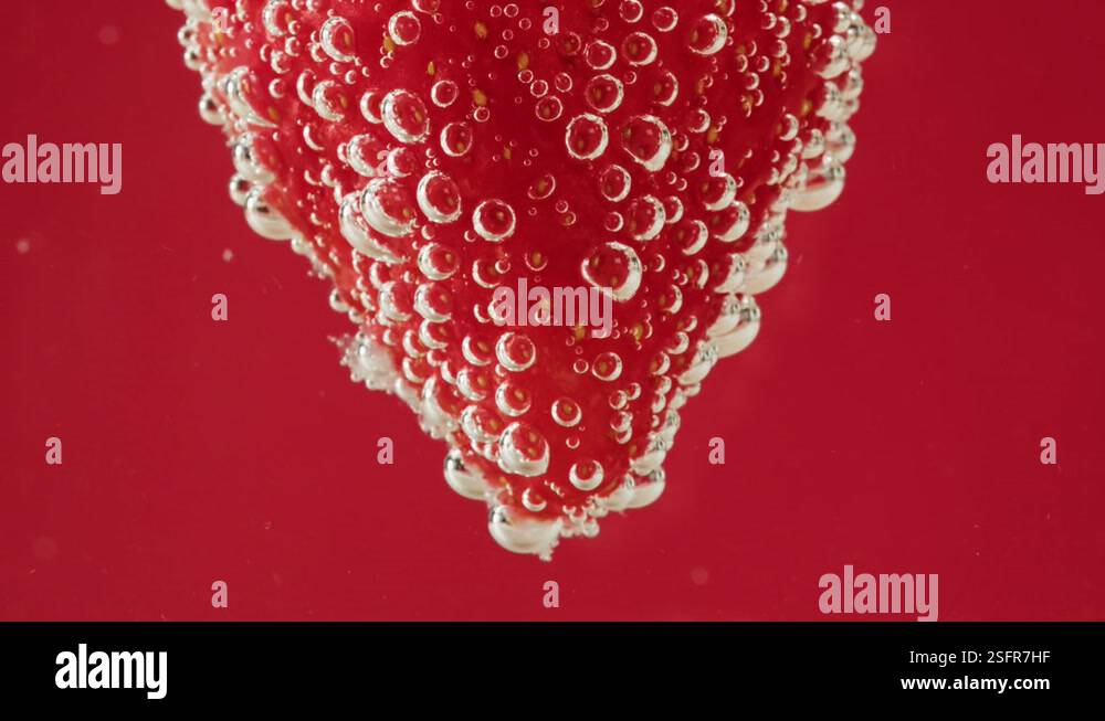 Strawberry in carbonated water. Cooking sweet cocktail, fizzy summer ...