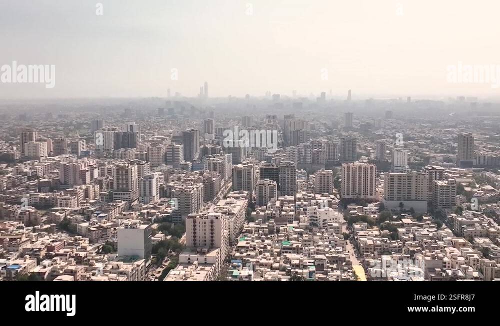 Aerial backward drone view of buildings in the Karachi city. shaheed e ...