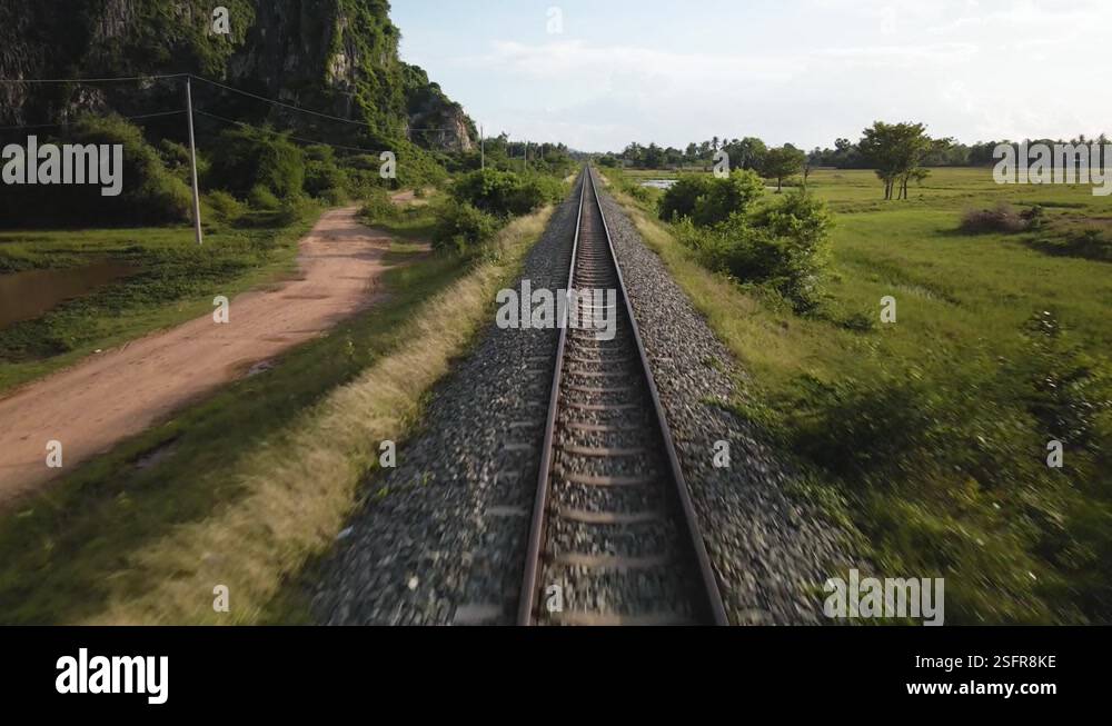 Straight narrow gauge rail way track travels to one point perspective ...