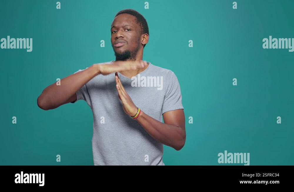 Serious tired person advertising timeout symbol with hands Stock Video ...