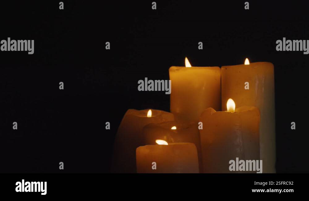 Burning wax candles on black chroma key background. Fire flame ...