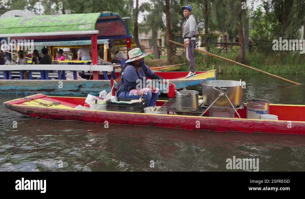 Going Past Mexican Women Vendor On Boat Fanning Food Along The ...