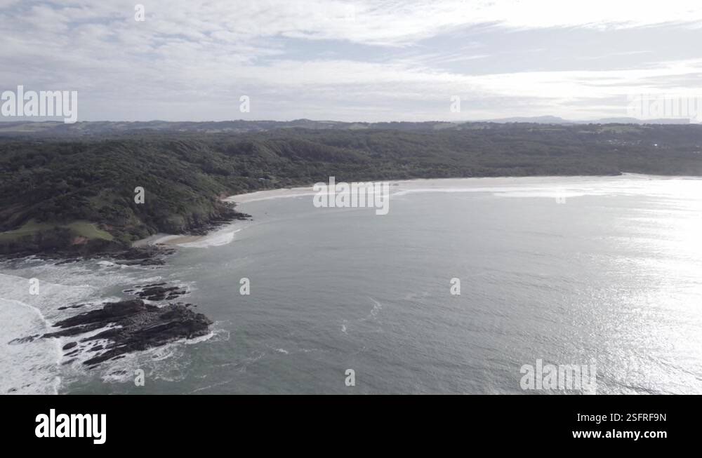 Scenery Of Headland With Foamy Ocean Waves Splashing On Rocks, Broken ...