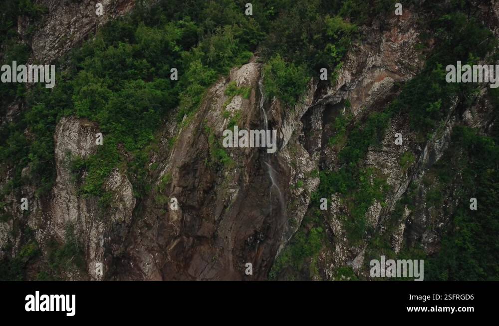 mountain streams come together and form a mountain river, top view ...