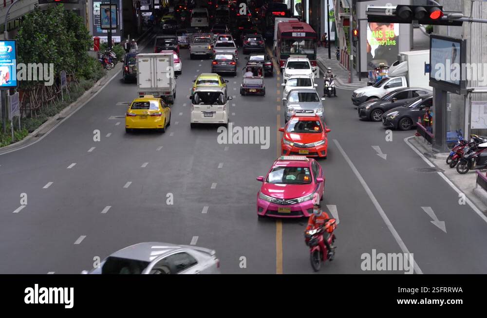 Heavy messy traffic of streets of Bangkok. Peak rush hour. High angle ...