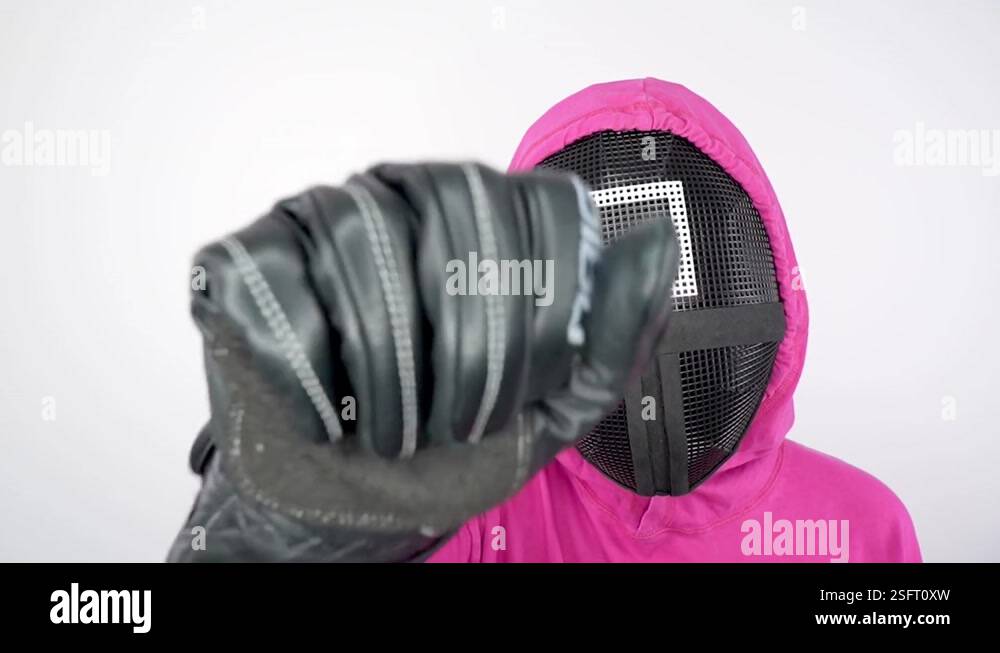 Squid Game pink guard knocking on camera in slow motion on white ...