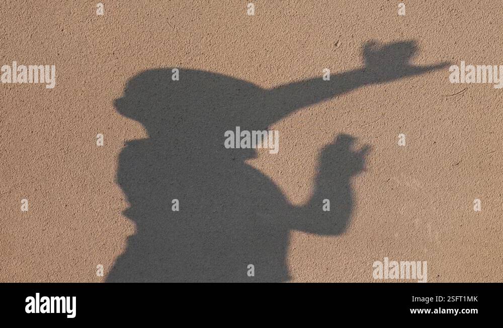 shadow of child is having fun. Blur shadows of child on wall. Game with ...