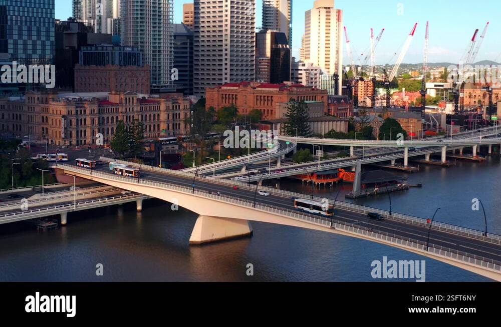 Traffic And Articulated Buses Driving Across Victoria Bridge Over ...