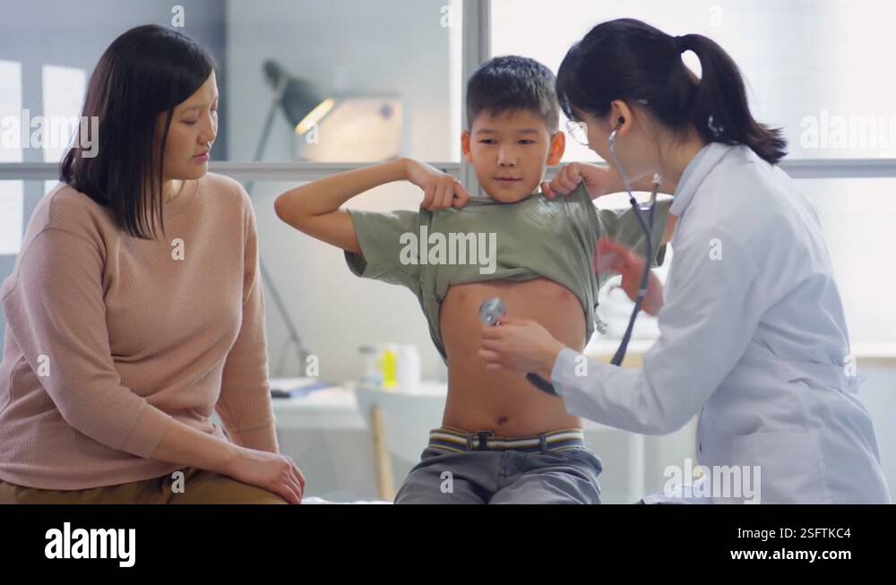 Asian Tween Boy on Health Checkup in Clinic Stock Video Footage - Alamy