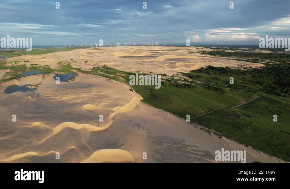 beautiful drone take on a paradise beach in the middle of the dunes and ...