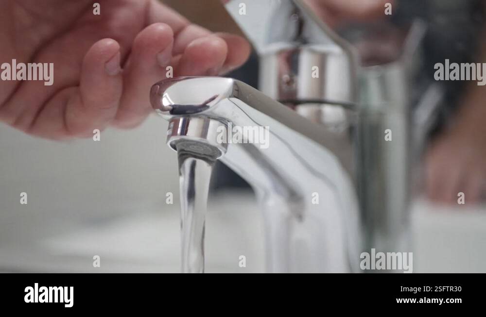 Closing the Water from the Sink Tap in the Bathroom after Washing Hands ...