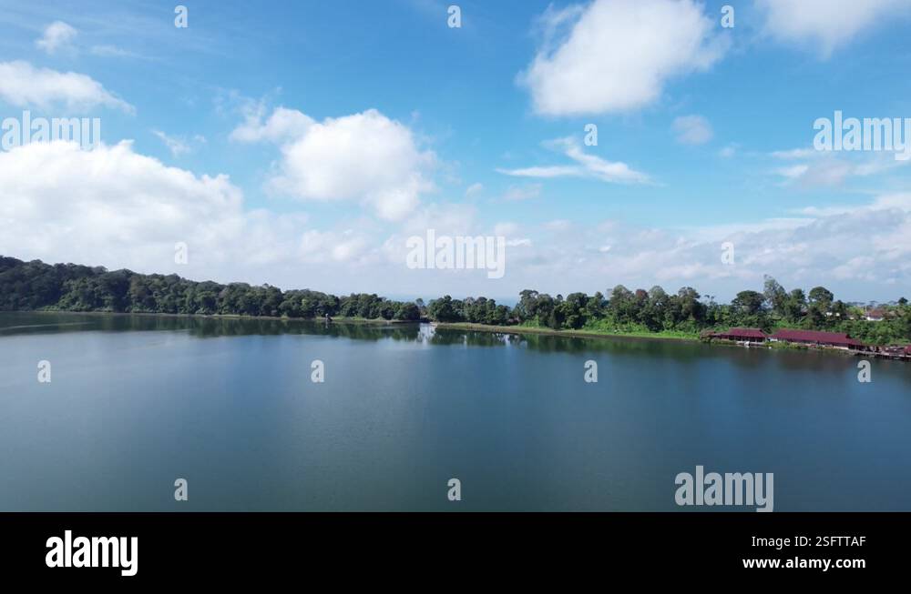 Aerial shot of Bratan lake, outflow dam seen ahead Stock Video Footage ...