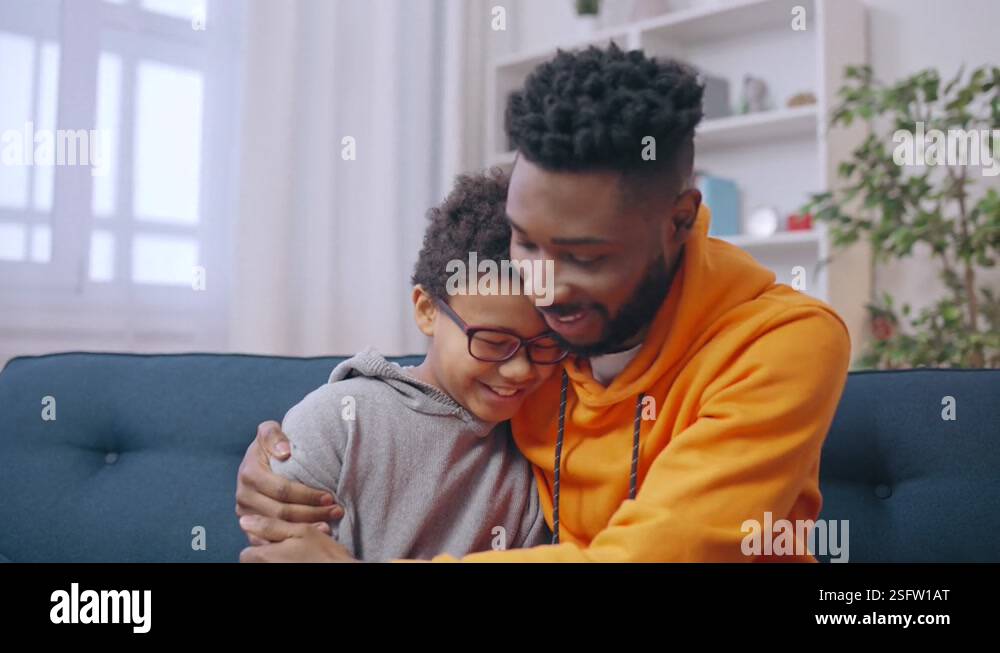 Two black brothers hugging, brotherly love, siblings spending time ...