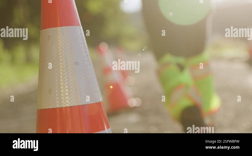Road Construction Flagger Placing Traffic Cones Along Road Stock Video ...