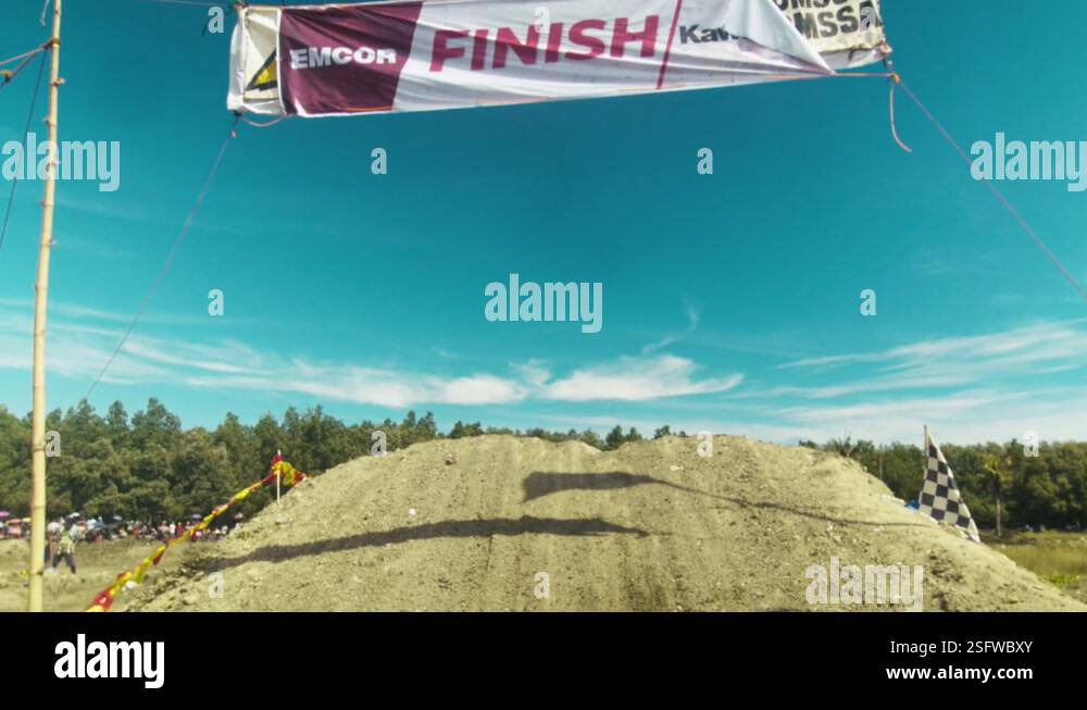 Clear skies as the finish line awaits roars of dirt bikes of the Stock ...