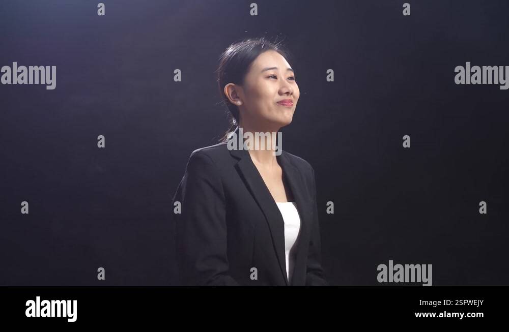 Side View Of Smiling Asian Speaker Woman In Business Suit Clapping Her ...