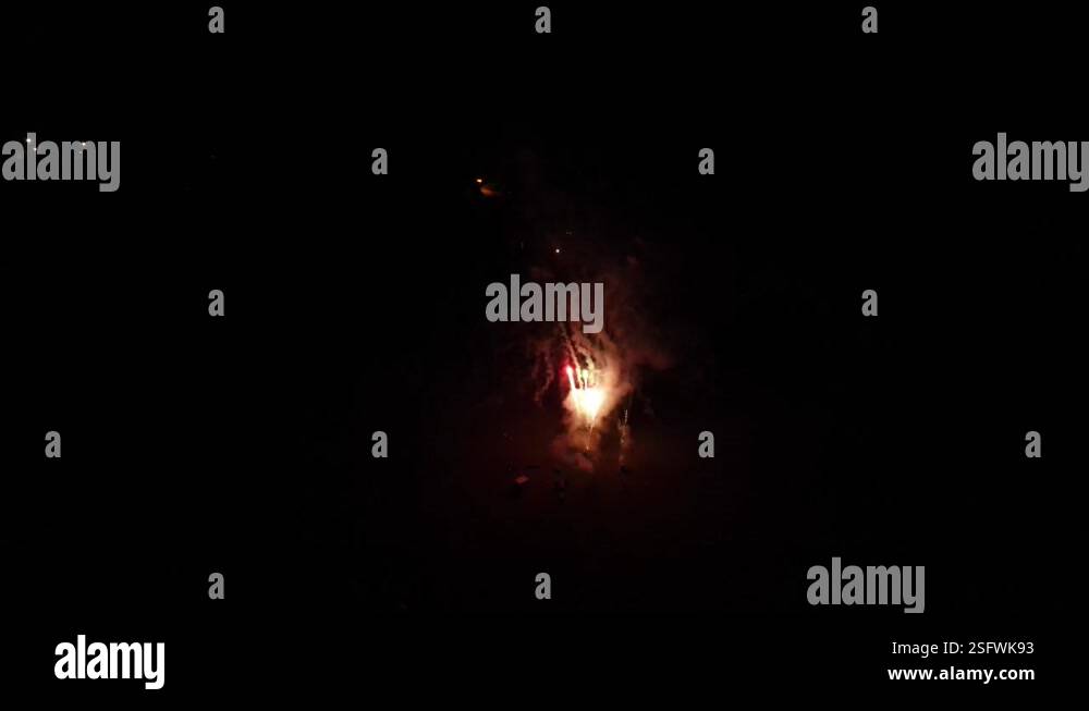 Shooting fireworks through a thick smoke cloud. The smoke is revealed ...