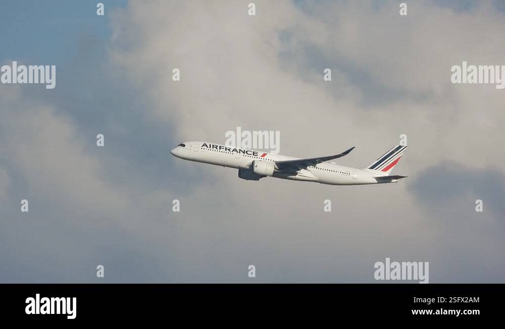 Air France plane flying high above the clouds after taking off from ...