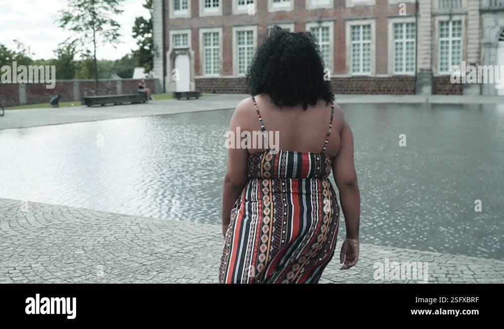 Walking black beautiful woman in Scherpenheuvel Belgium Stock Video ...