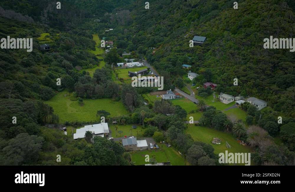 Aerial: Bach Homes Nestled At The Foot Of The Hills In Karekare ...