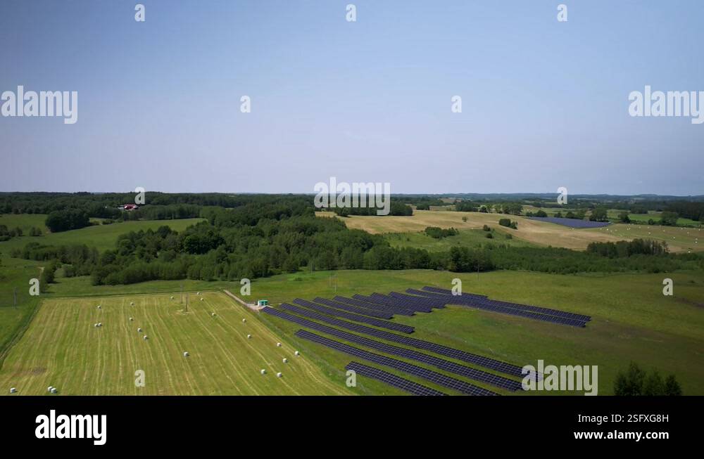 Agricultural field after harvesting grain with rolls of hey and Solar ...