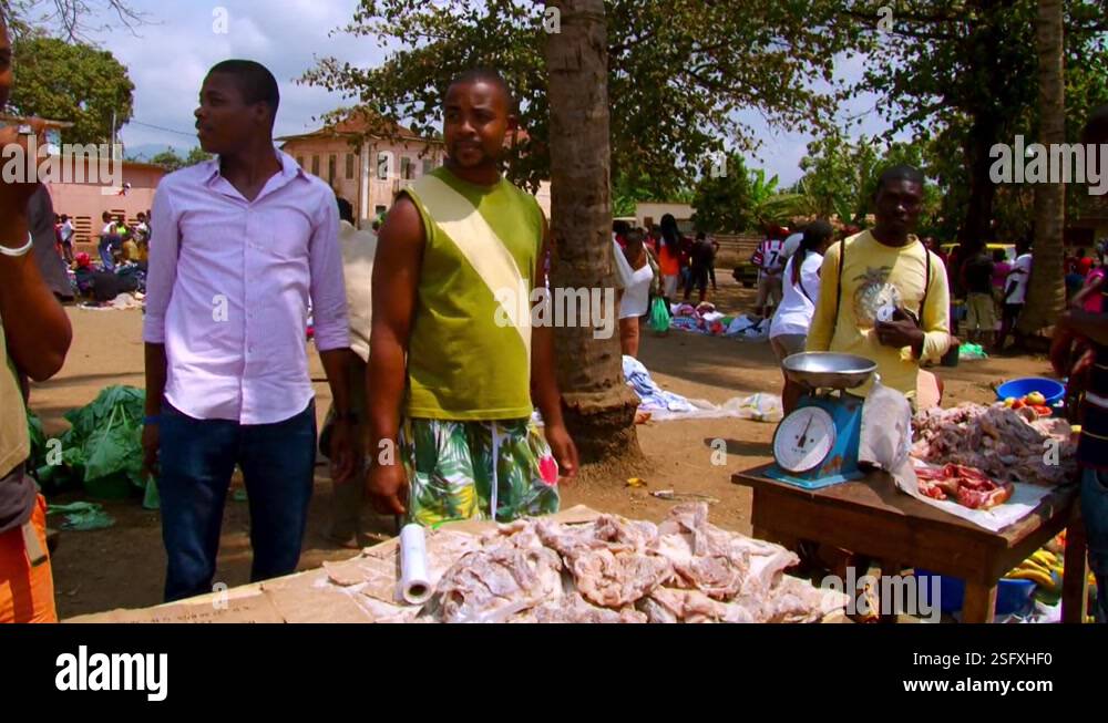 Men, meet, talk and visit at the village market in Sao Tome and ...