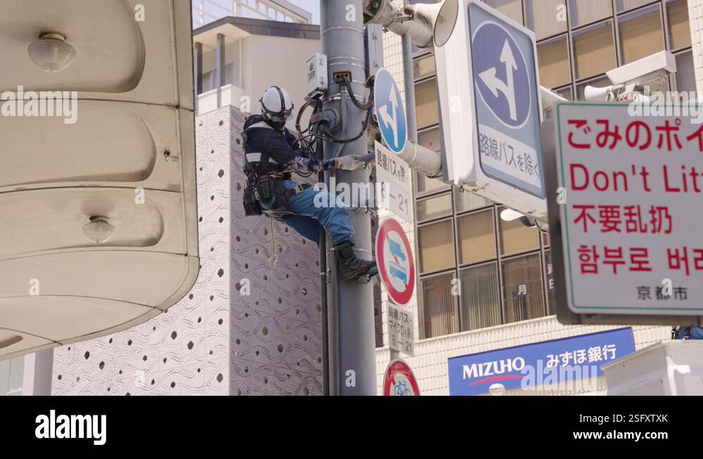 Japanese Maintenance Man Repairing Street Signs in Kyoto during Summer ...