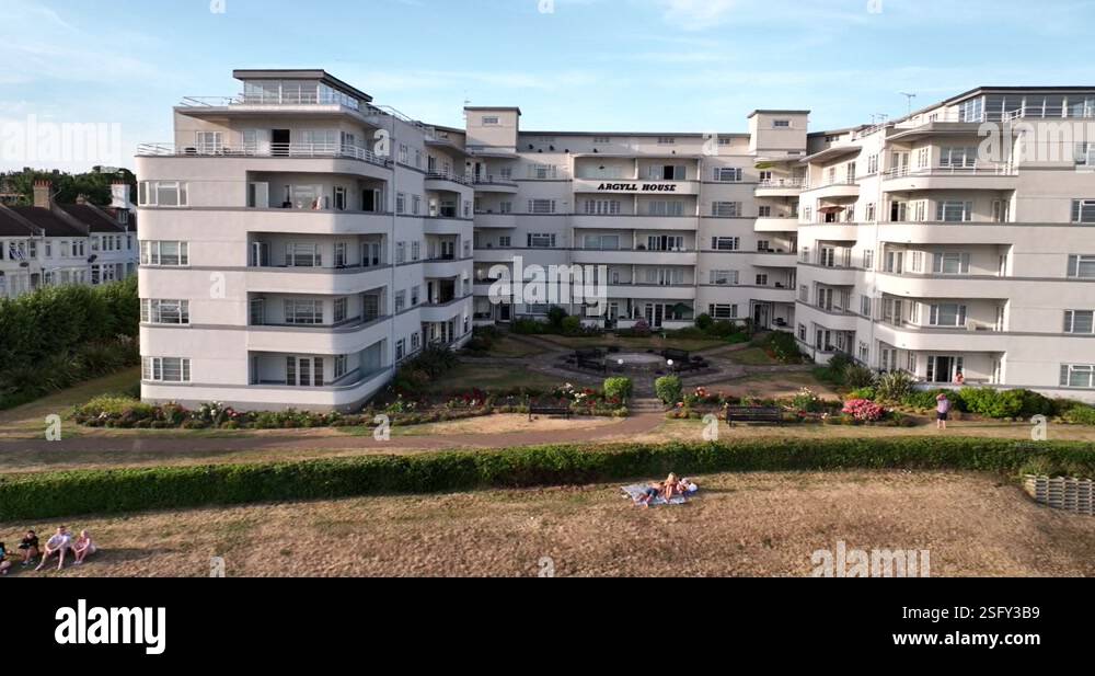 Apartment buildings in residential urban borough lit by late afternoon ...